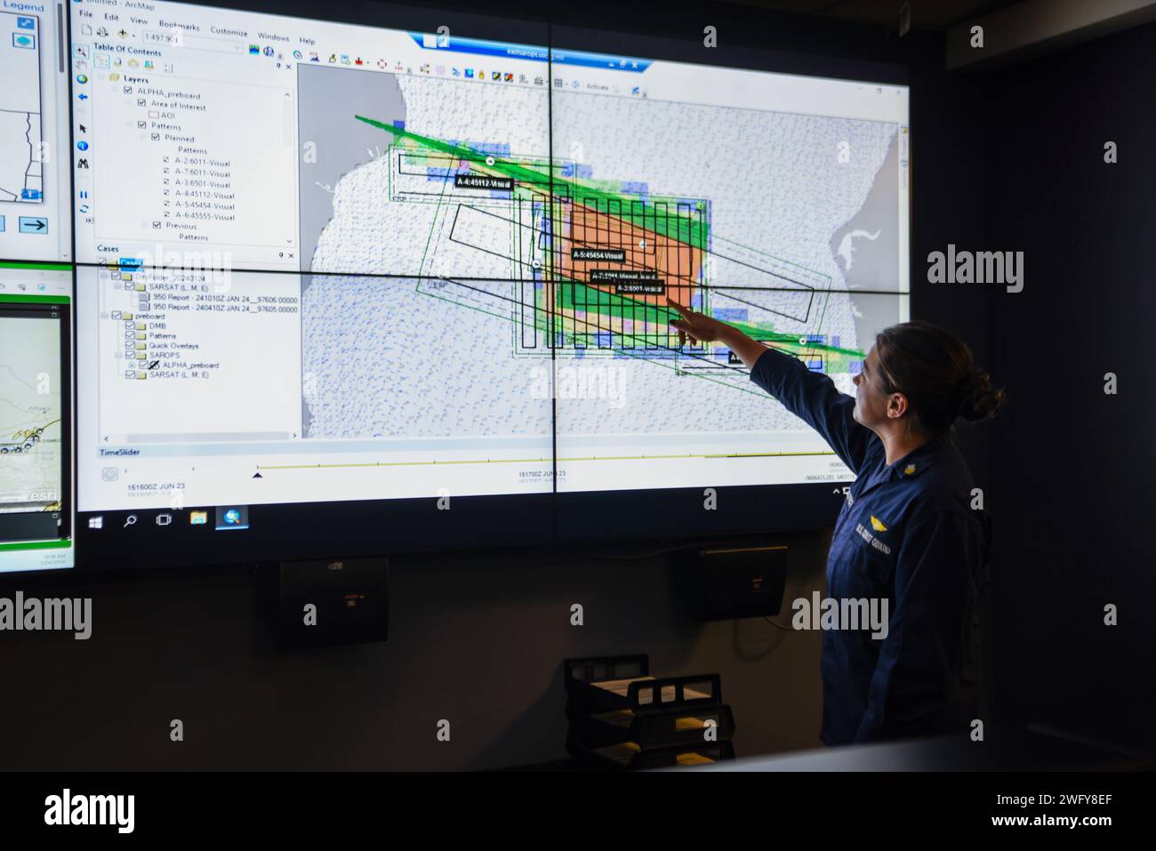 U.S. Coast Guard Petty Officer 1st Class Emily Traikovich, an ...