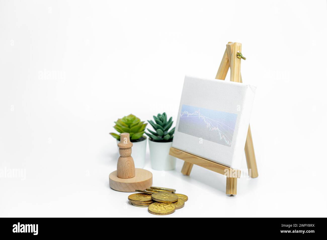 Mannequin drawing a graph charts on easel; isolated on white background ...