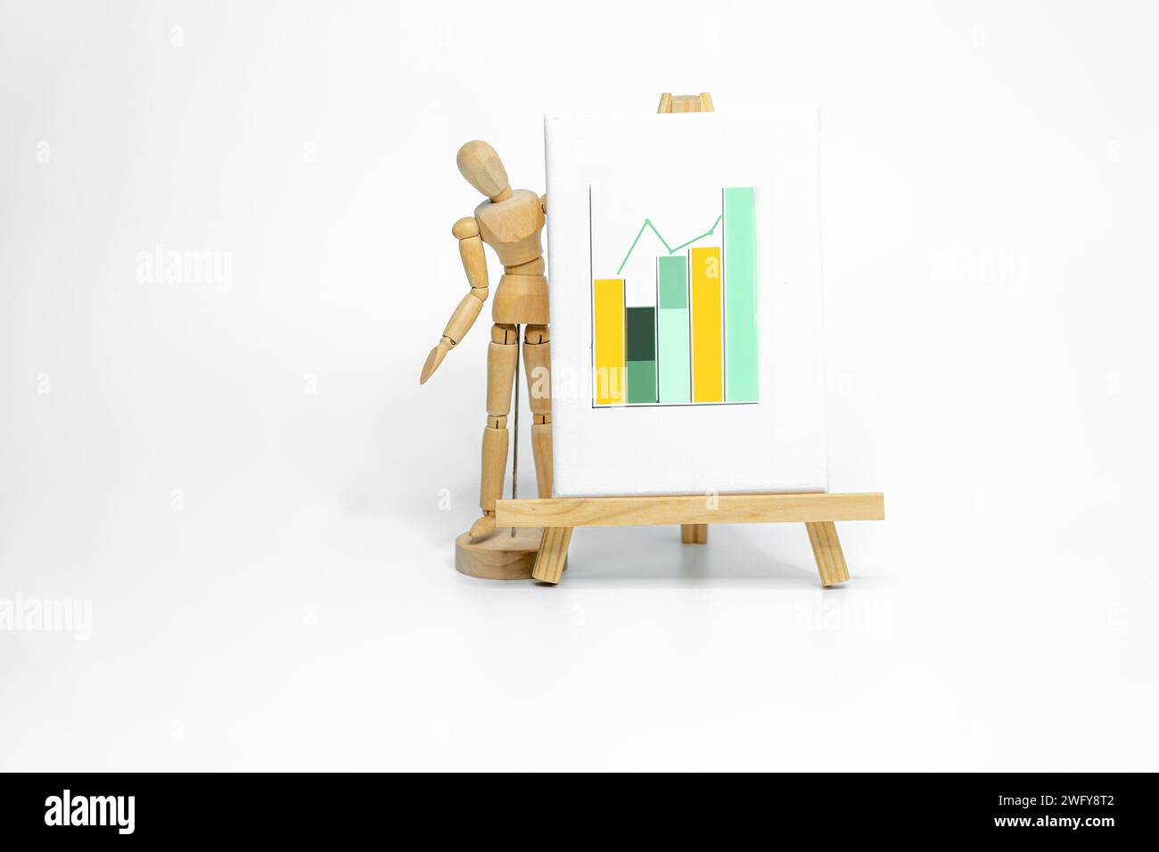 Mannequin drawing a graph charts on easel; isolated on white background ...