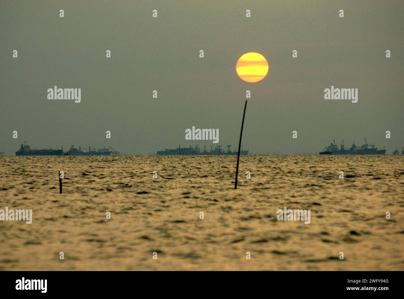 Full cycle of the sun, poles, and Jakarta port traffic on Bay of ...