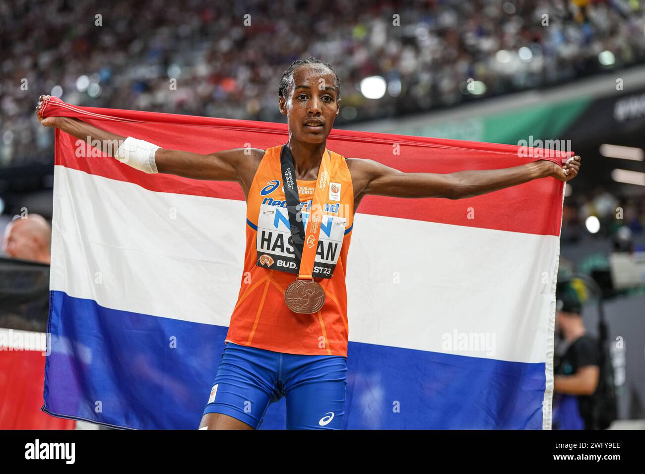 Sifan HASSAN celebrating his medal with the flag in the Budapest 2023 ...