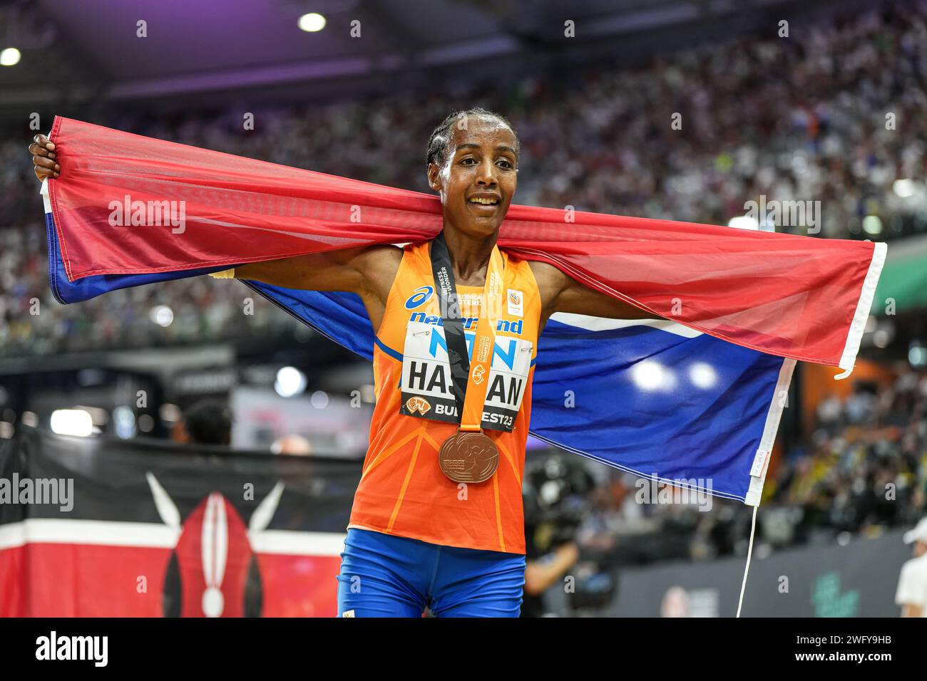 Sifan HASSAN celebrating his medal with the flag in the Budapest 2023 ...