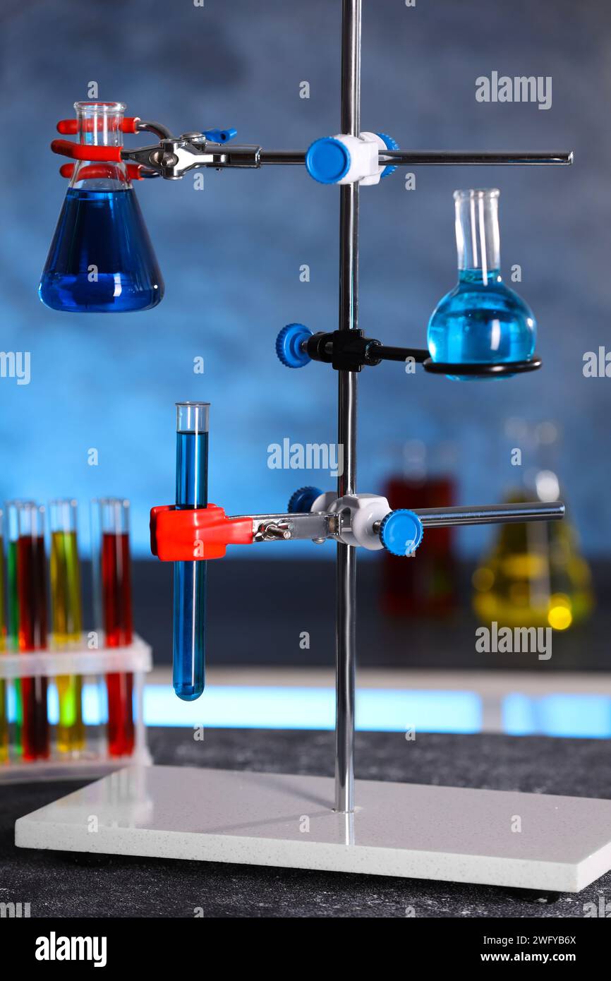 Laboratory glassware with blue liquid on retort stand indoors Stock ...