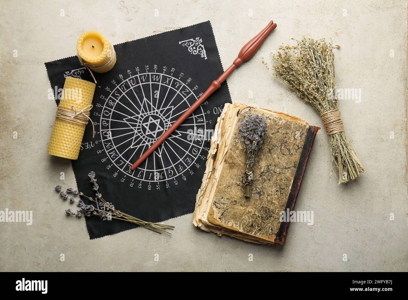 Flat lay composition with magic wand and divination cloth on light ...