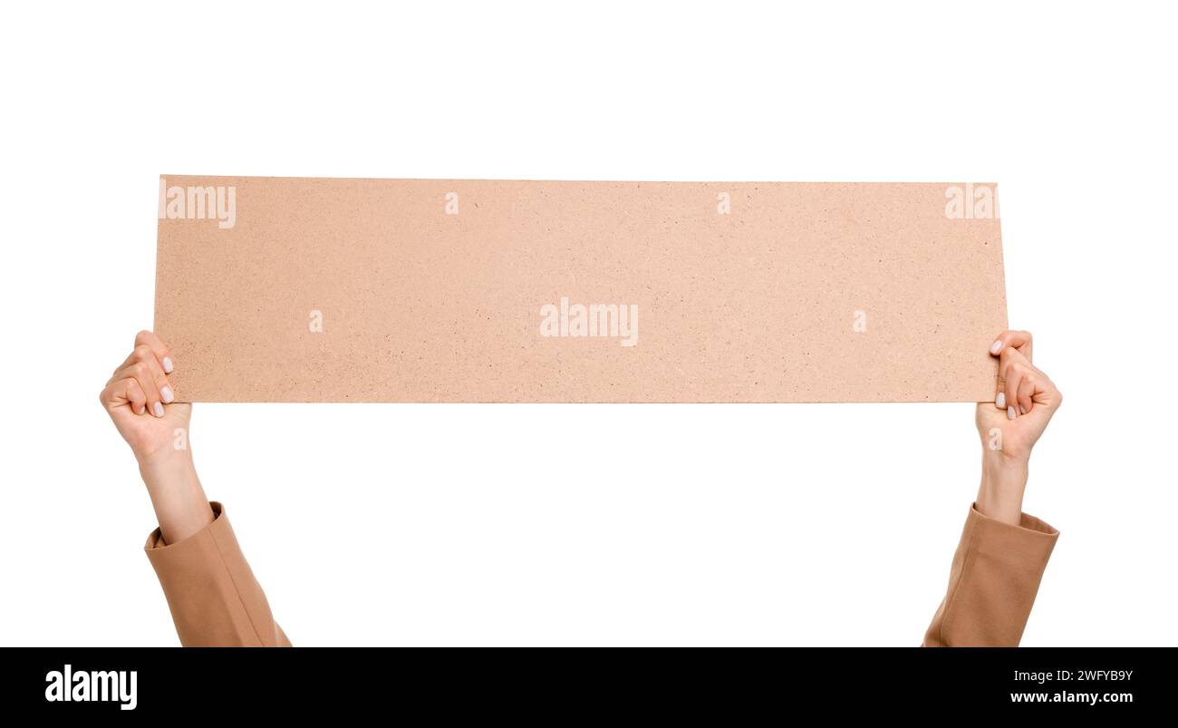 Woman holding blank cardboard banner on white background, closeup ...