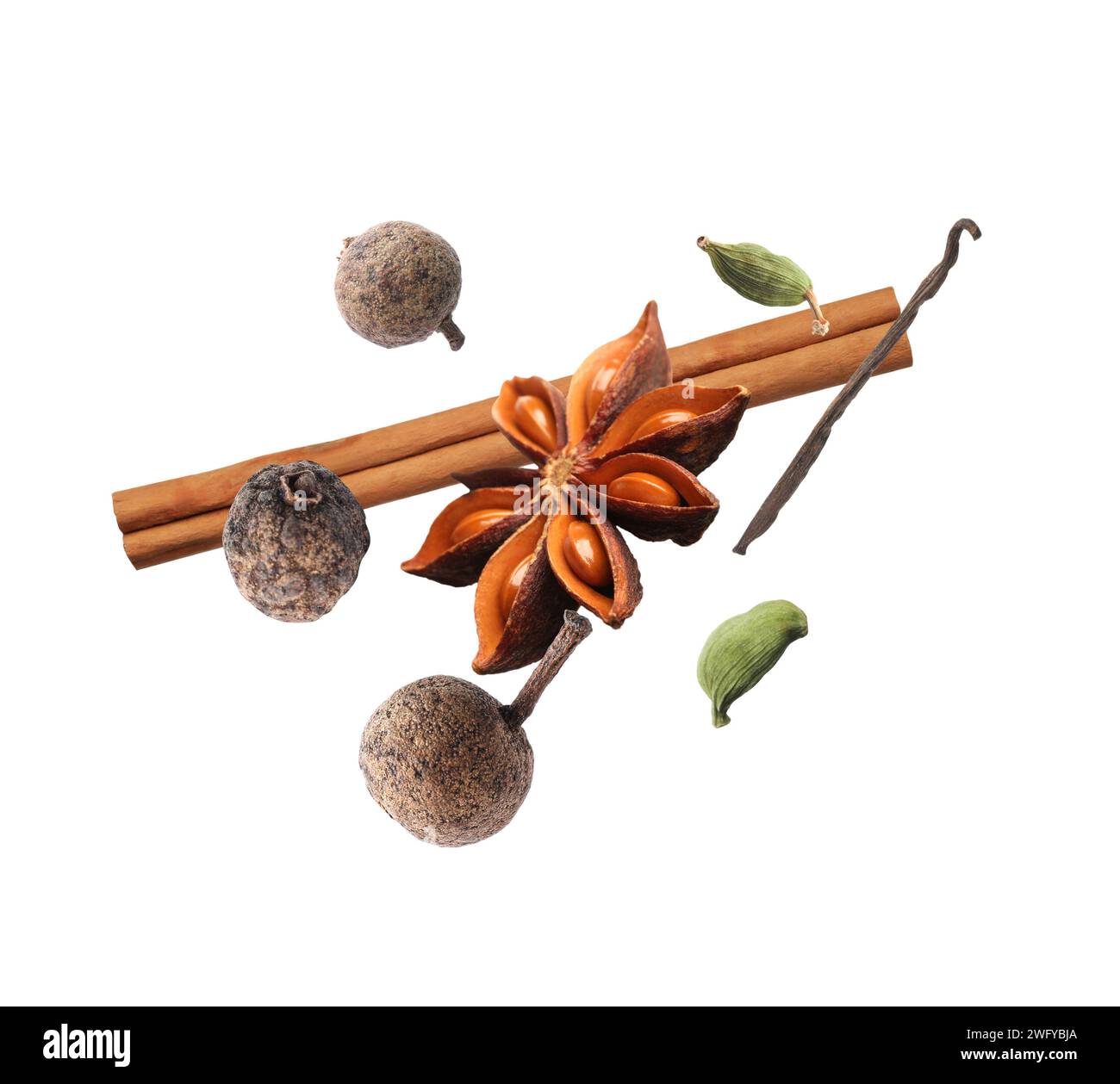 Different aromatic spices falling on white background Stock Photo - Alamy