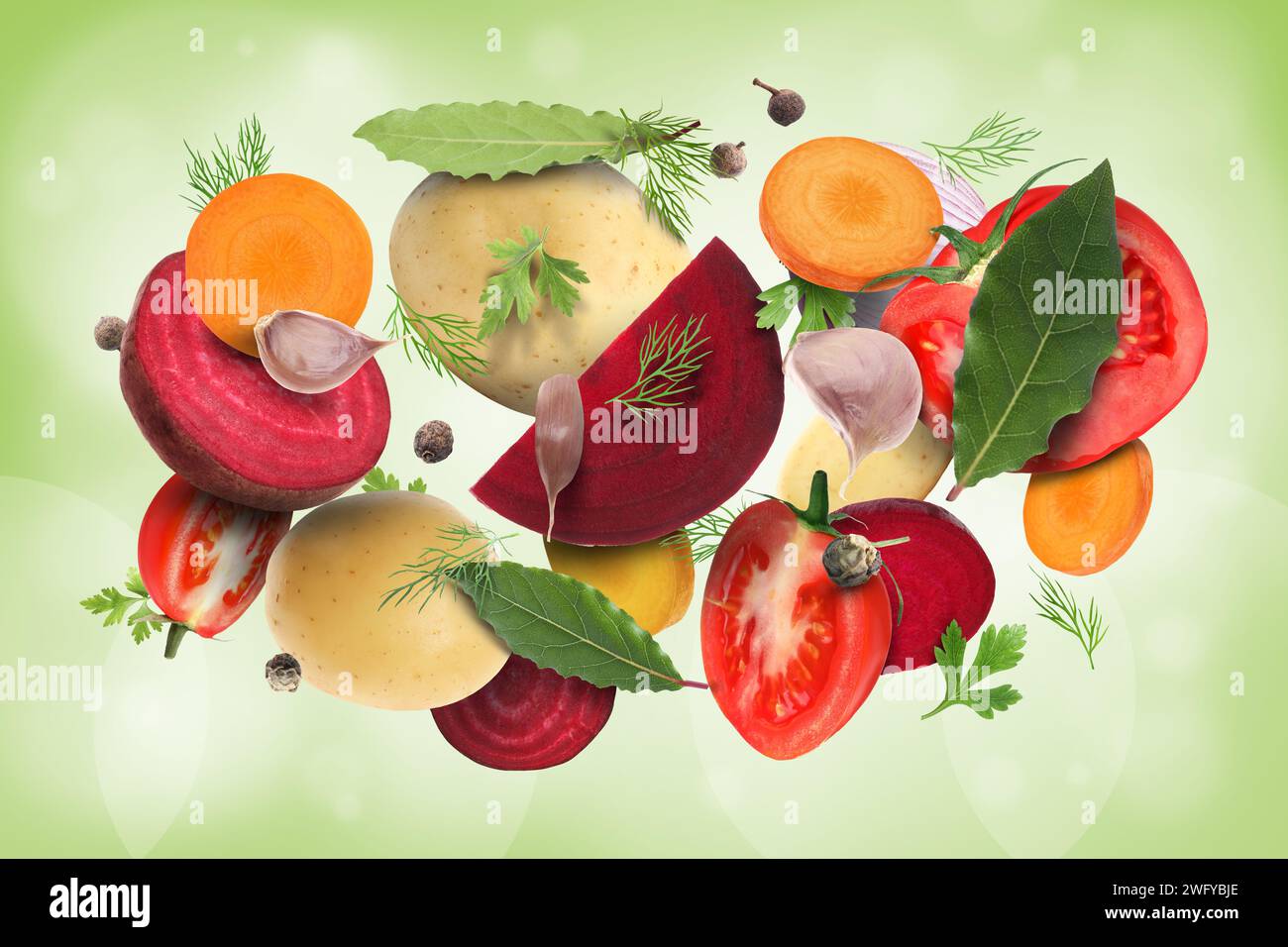 Different fresh vegetables and spices in air on green background Stock ...