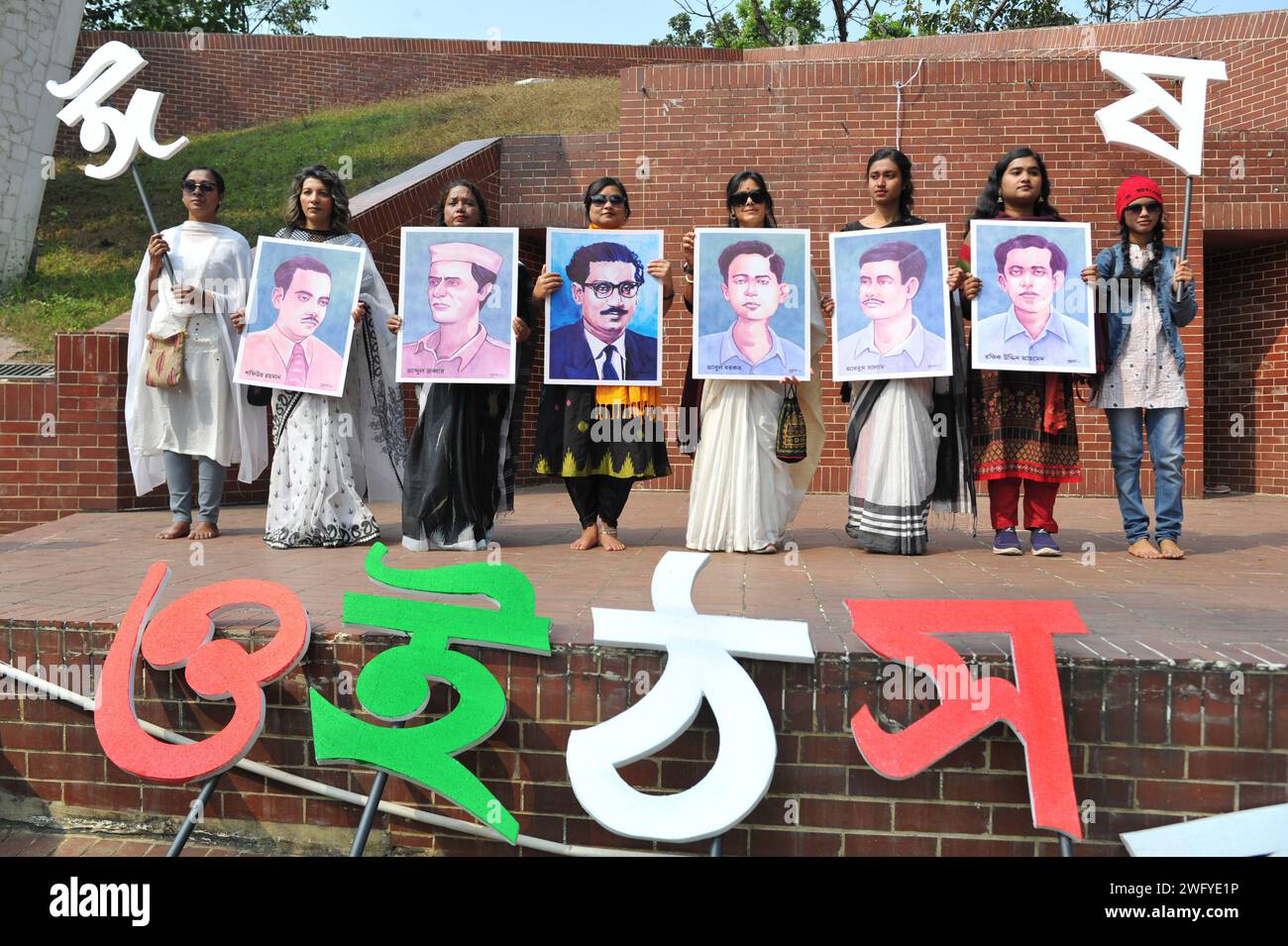 Culture activists at an alphabet march holding pictures of language ...