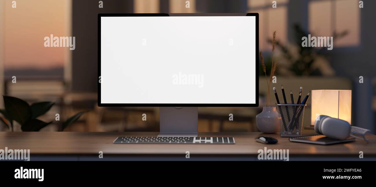 A white-screen computer mockup and decor on a hardwood desk in a modern ...