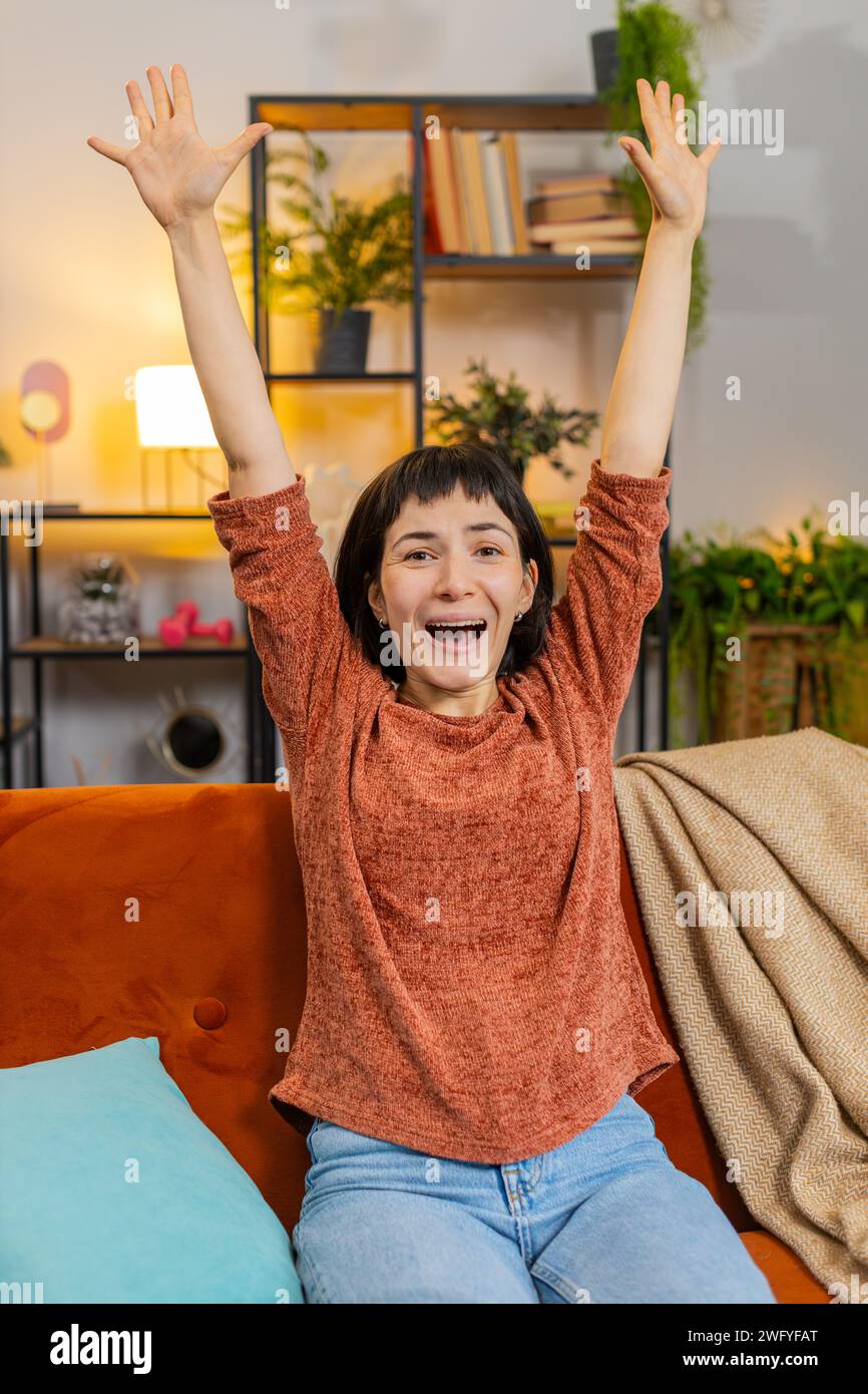 Portrait of happy woman shouting, celebrating success victory, winning ...