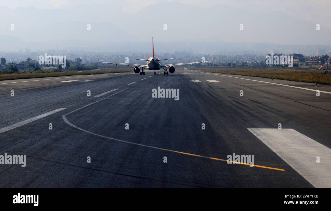 airline is ready to fly on the runway with cityscape background in ...