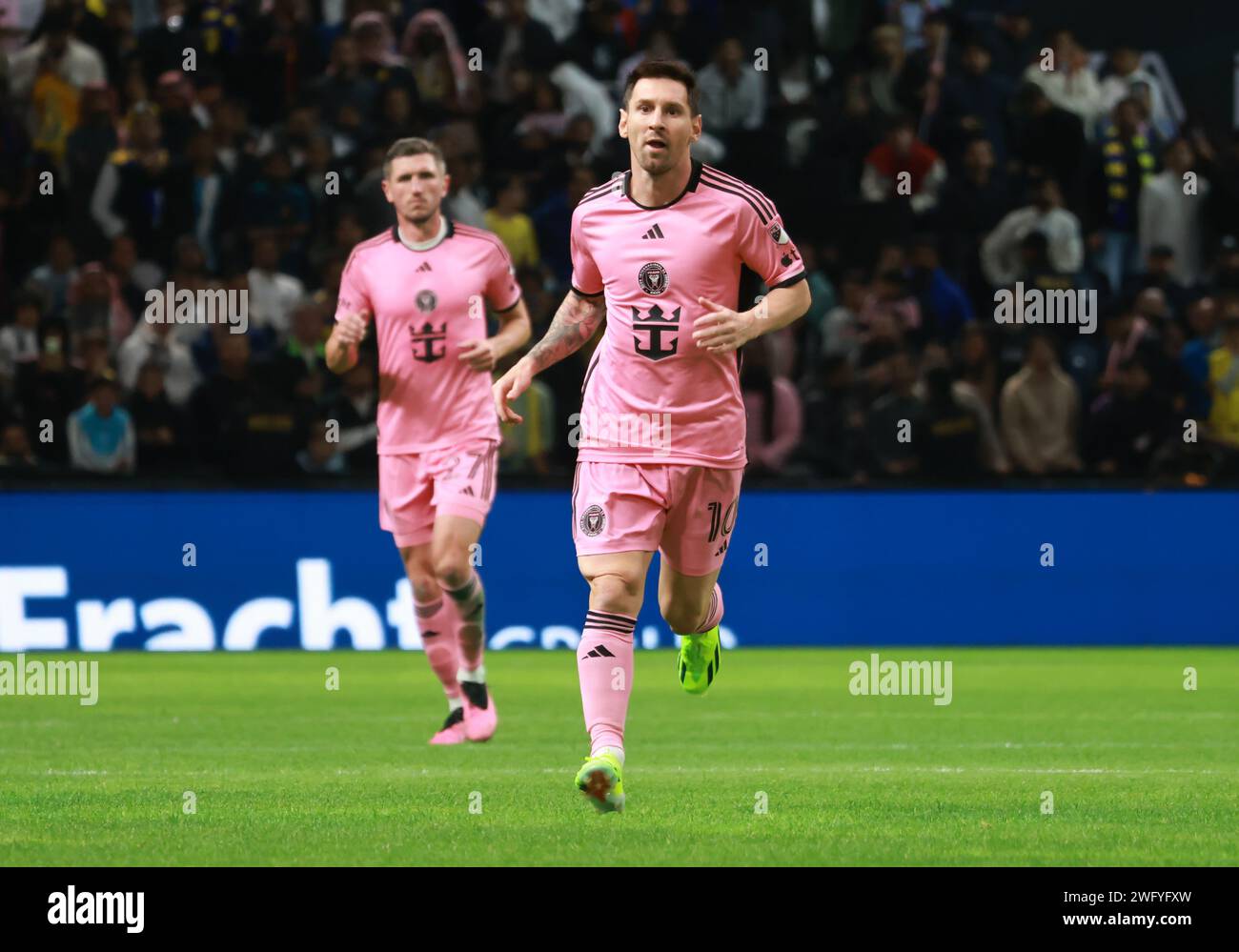 Riyadh, Saudi Arabia. 1st Feb, 2024. Inter Miami's Lionel Messi (R) and ...