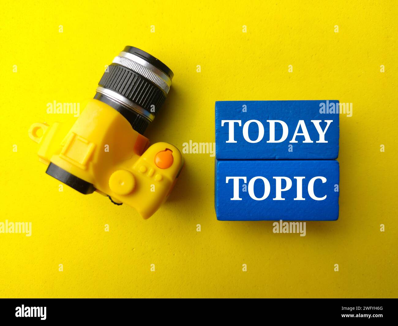 Top view toy camera with text TODAY TOPIC on yellow background Stock ...