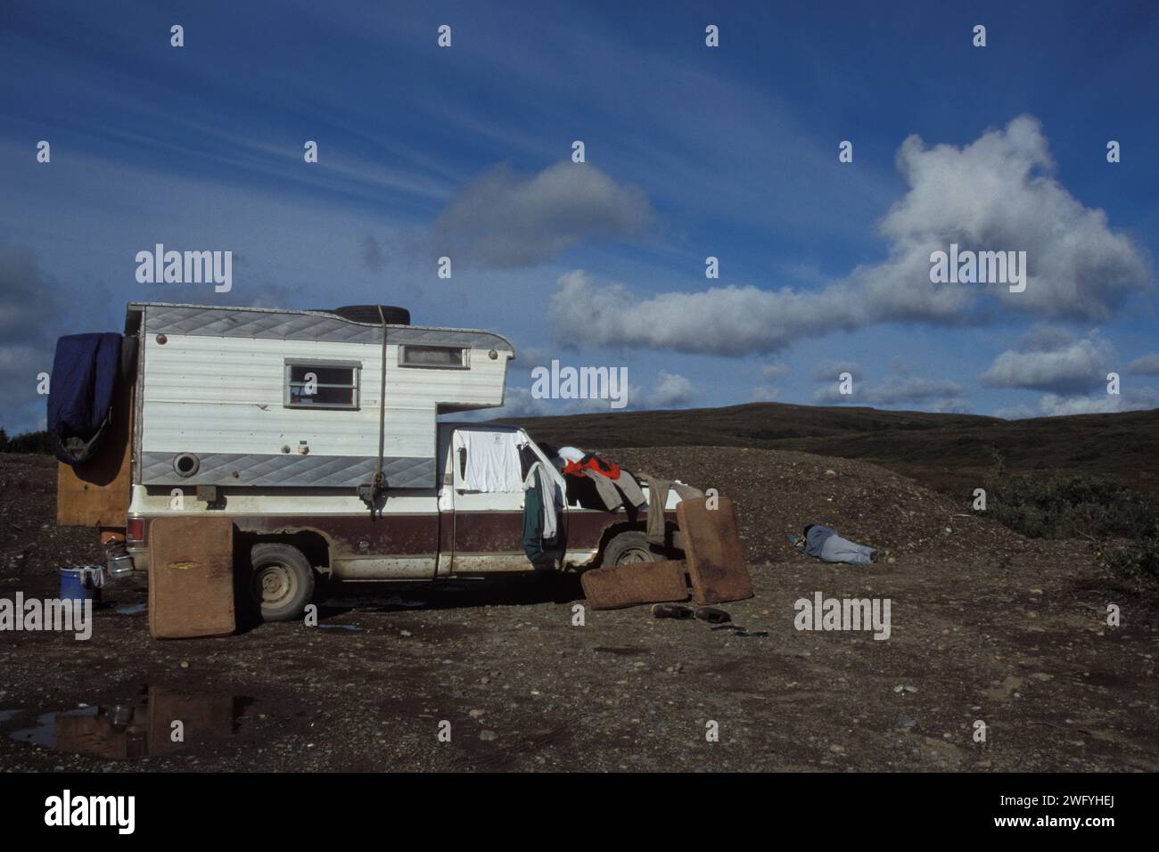photographer Steven Kazlowski taking a nap while airing out his camper ...