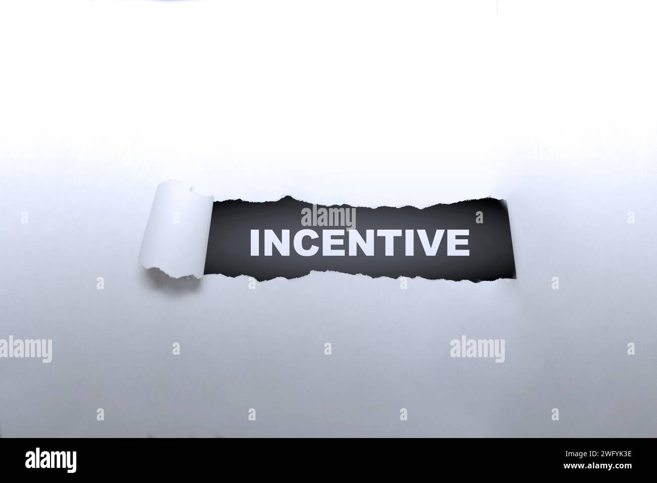 Ripped paper with incentive text over a black background. Business ...