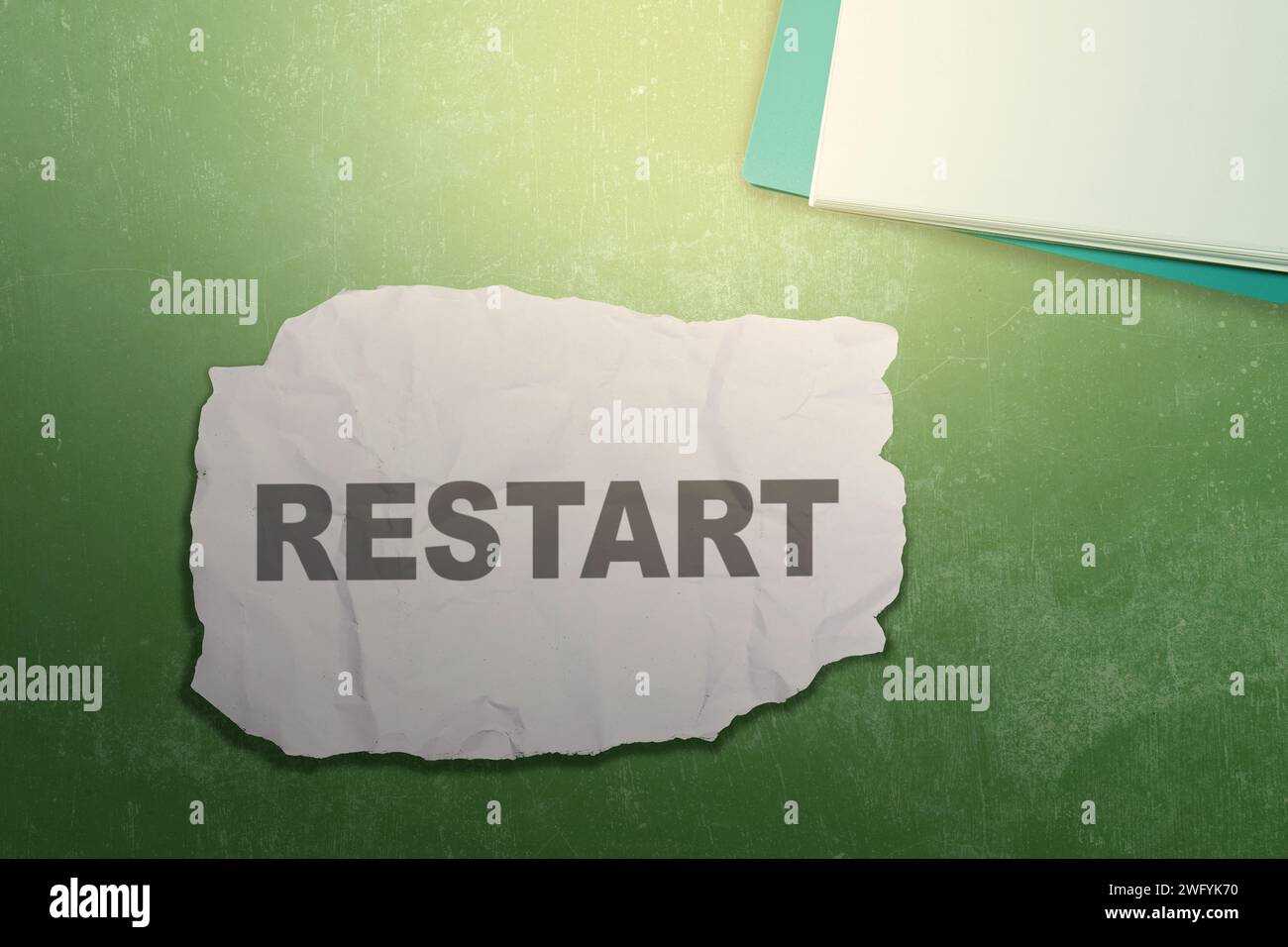 Text of restart on ripped paper over a colored background. New ...