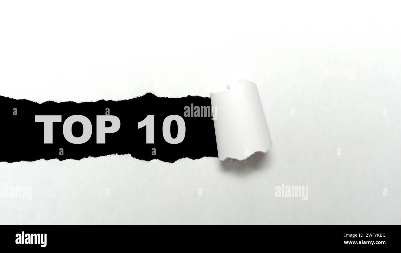 Ripped paper with the text of the top 10 over a black background ...