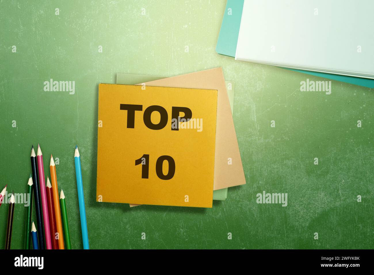 Stack of notes with the text of the top 10 over a colored background ...