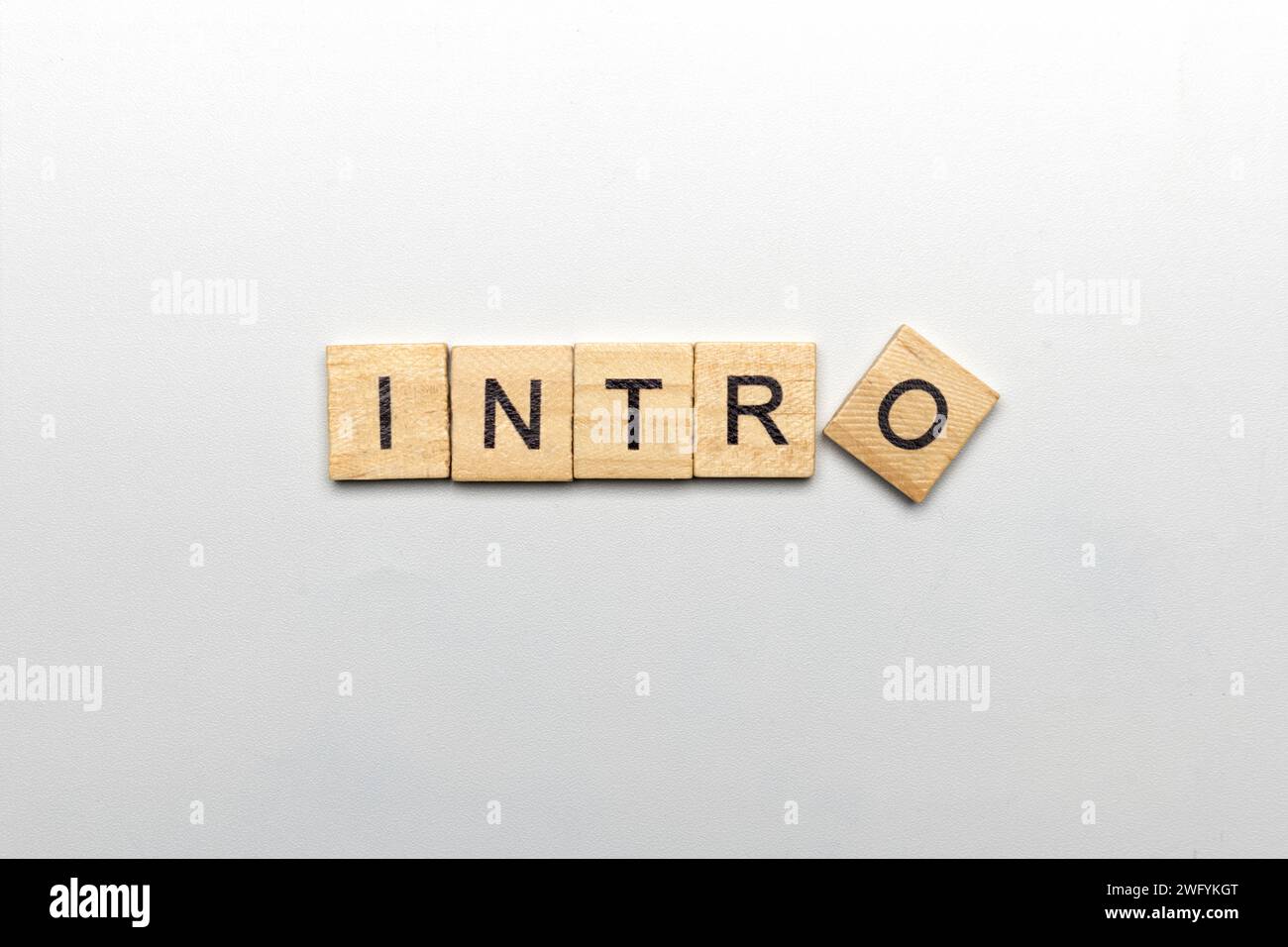 A row of wooden cubes with intro text over a white background ...