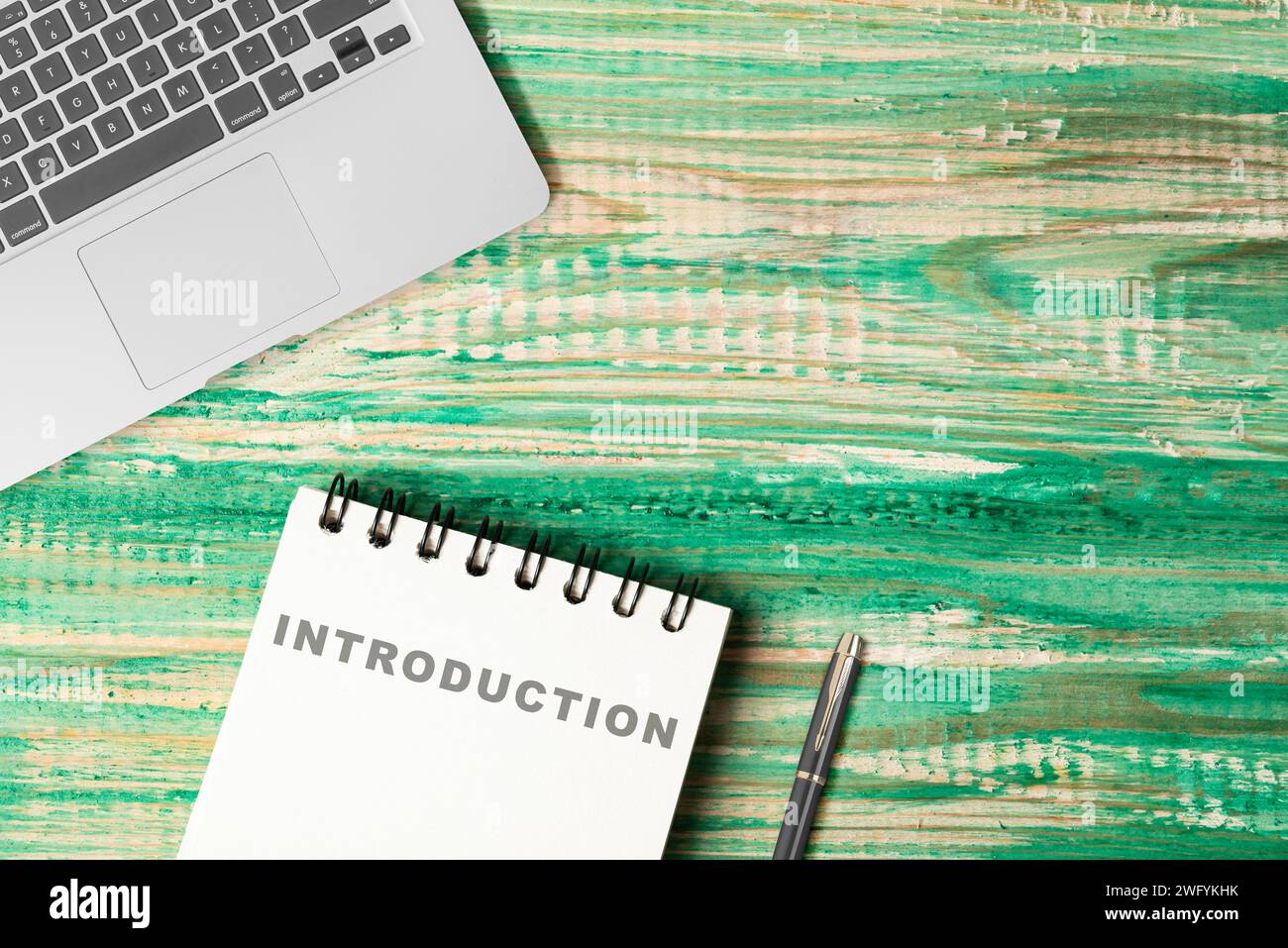 Note with introduction text on wooden background. Introduction concept ...