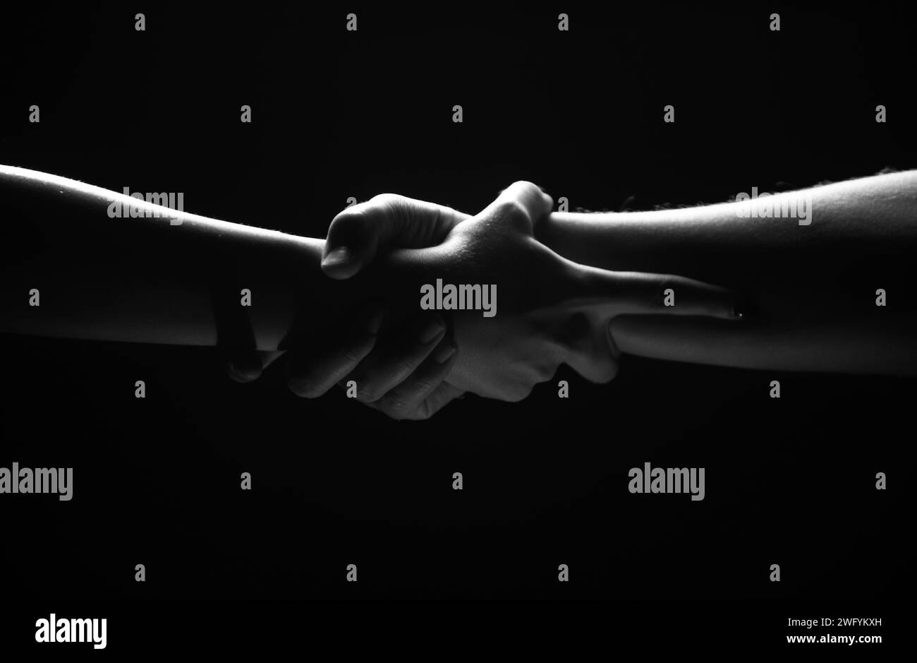 Hands gesturing on black background. Giving a helping hand. Support and ...