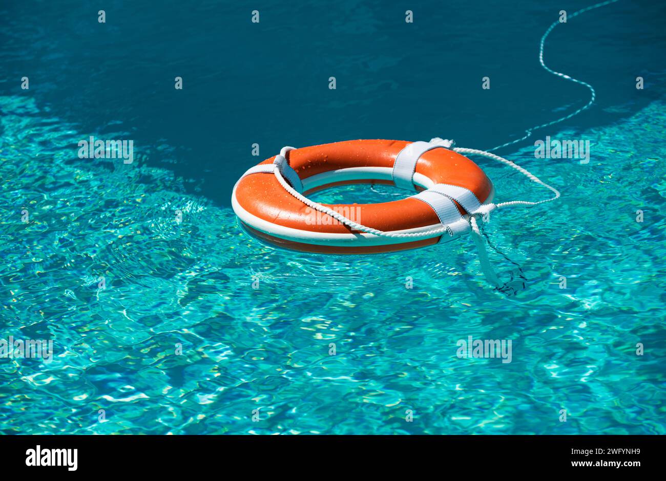 Life buoy for safety at pool in water. Safety equipment, rescue buoy ...