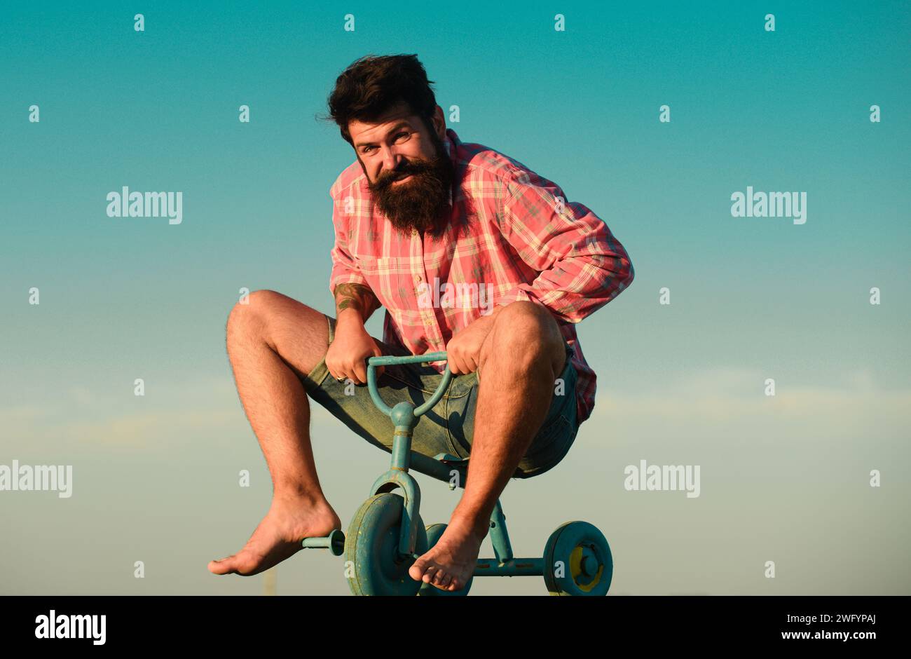 Old man acting like a kid. Funny bicycle rider. Comic man ride bike ...