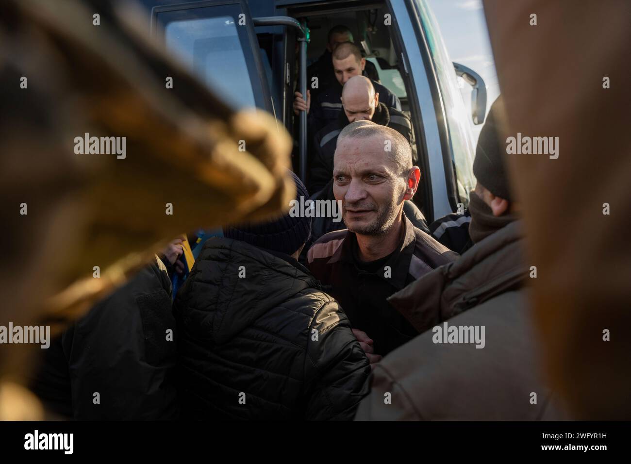 Recently swapped Ukrainian prisoners of war arrive by bus after a ...
