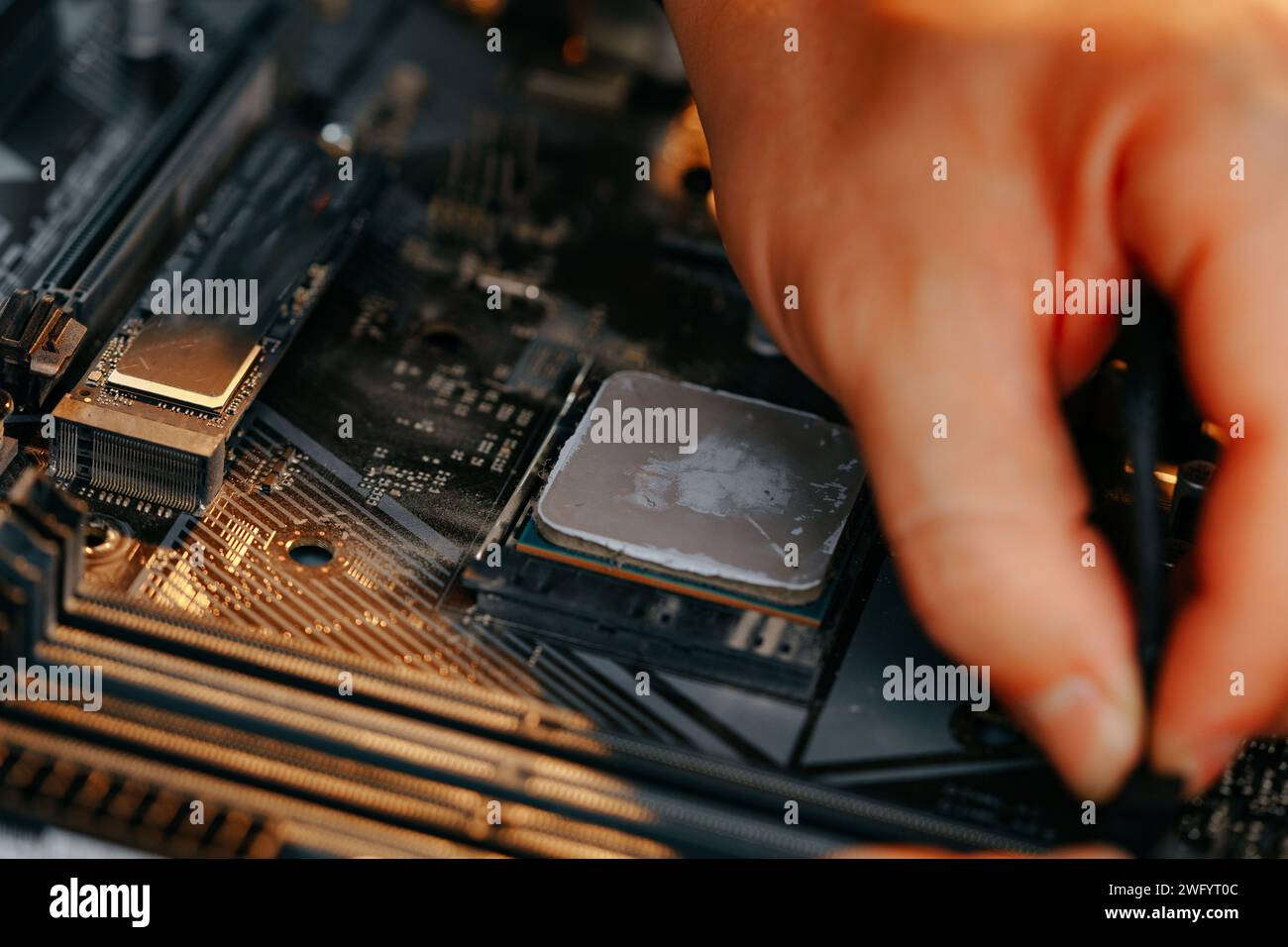Man repairing computer motherboard hi-res stock photography and images ...