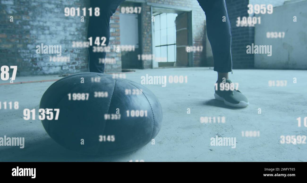 Image of floating numbers over man exercising with a ball Stock Photo ...
