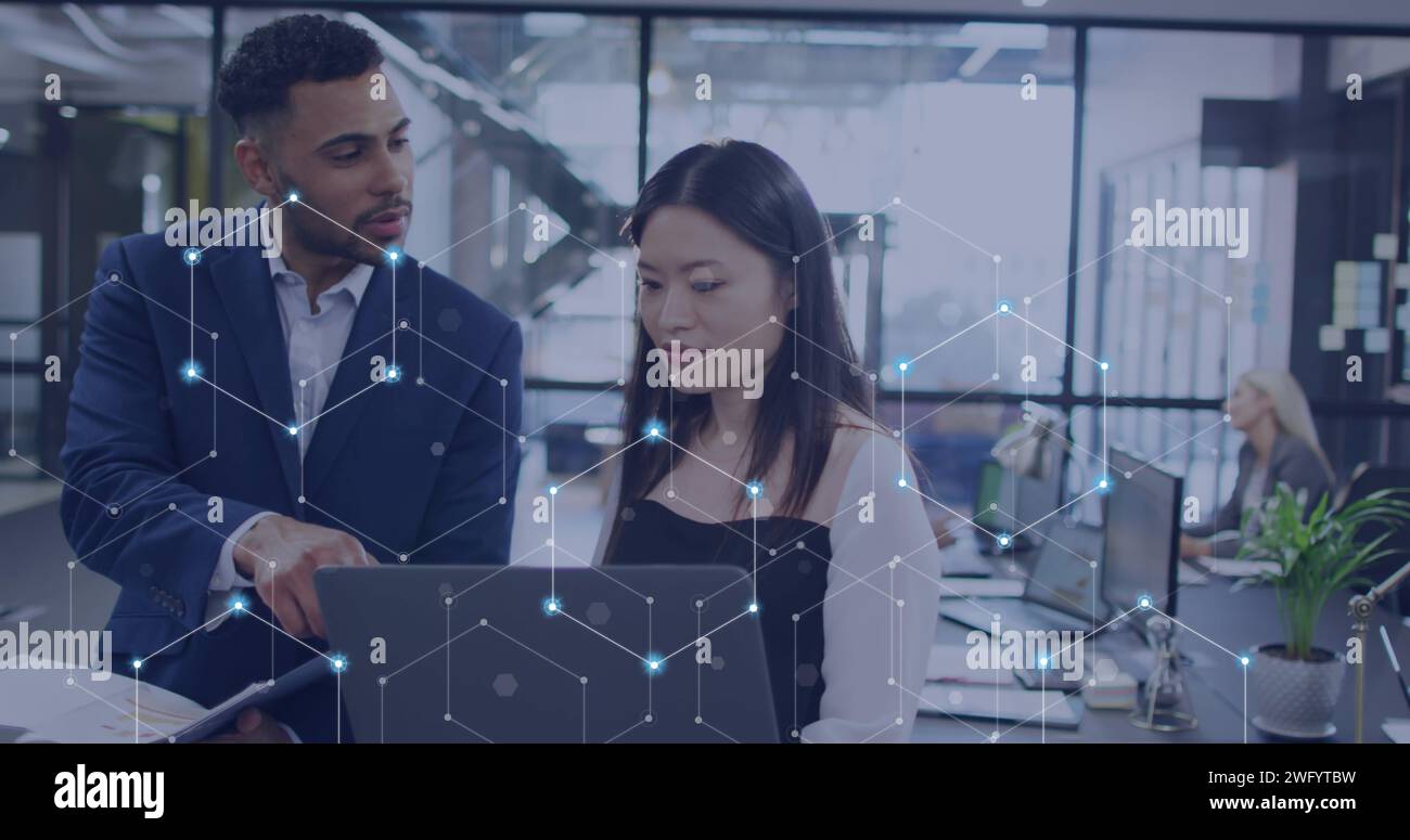 Image of network of connections with icons over diverse business people ...