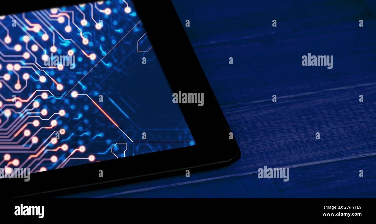 Image of tablet with data processing on blue background Stock Photo - Alamy