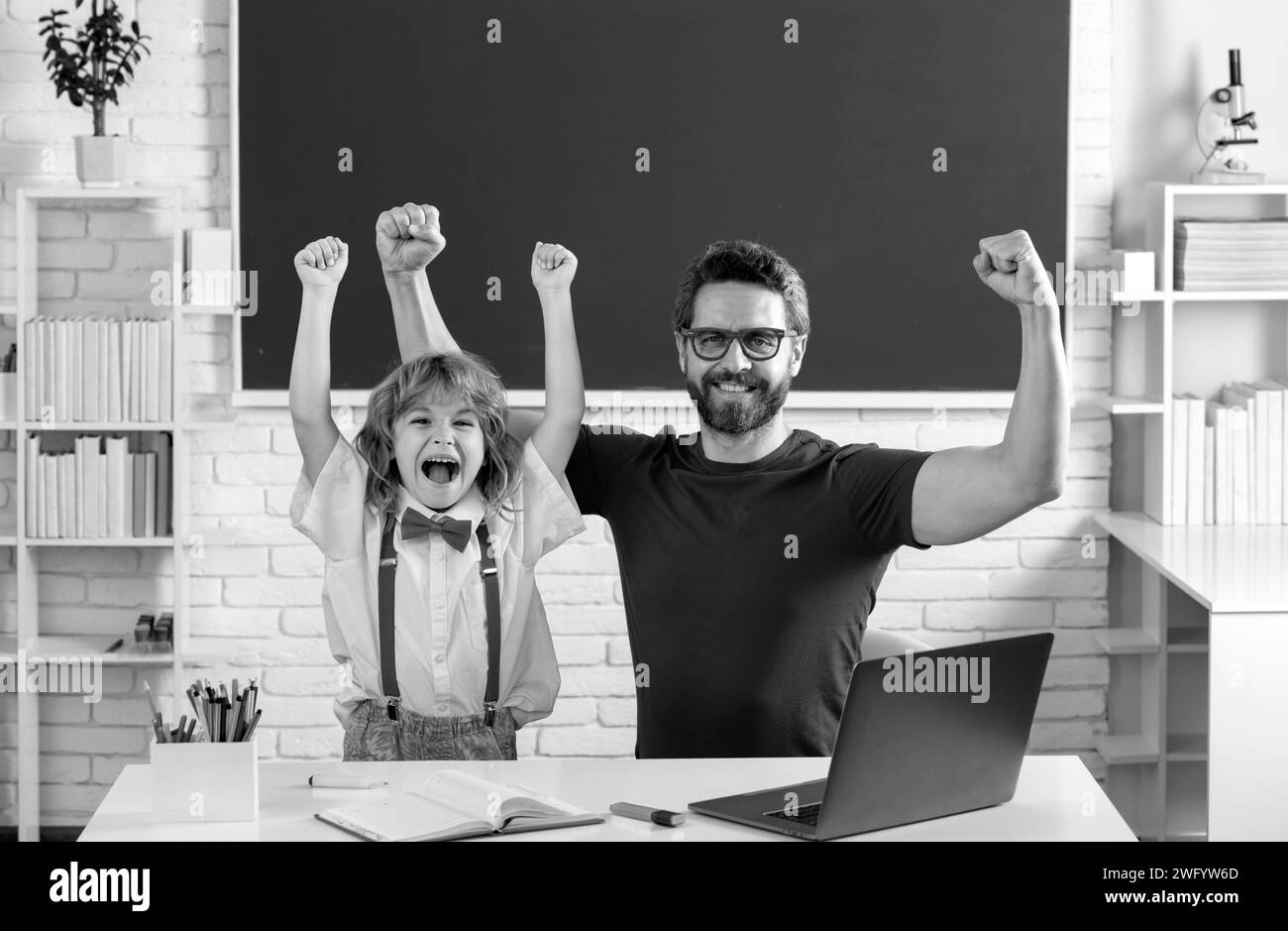 Excited school kid and teacher learning study in class. Education and ...