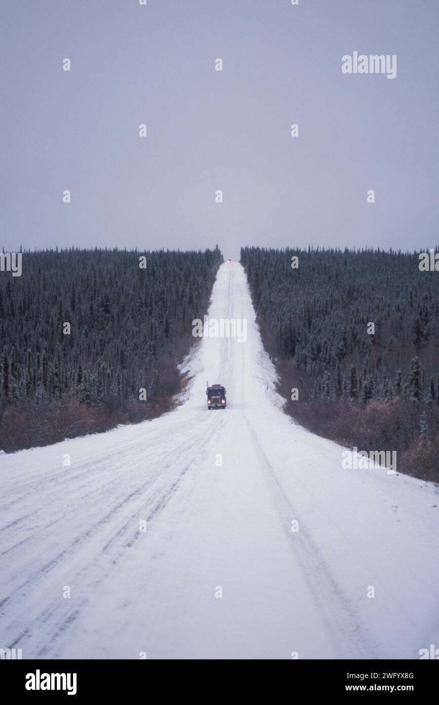 semi-truck travelling down a snowy Haul Road, southside of Brooks Range ...