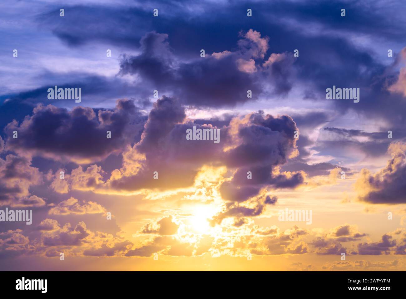 Colorful sky and sun rays. Stormy dramatic sky. Big cloud above ocean ...