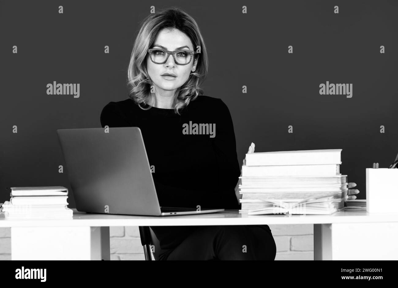 Modern attractive beautiful teacher. Portrait of smart young woman in ...