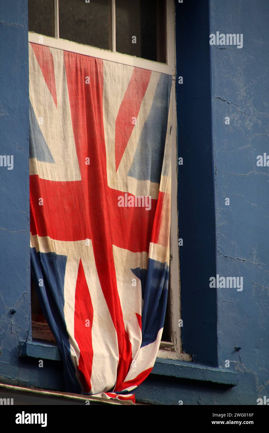 The british flag hanging from a building Stock Photo - Alamy