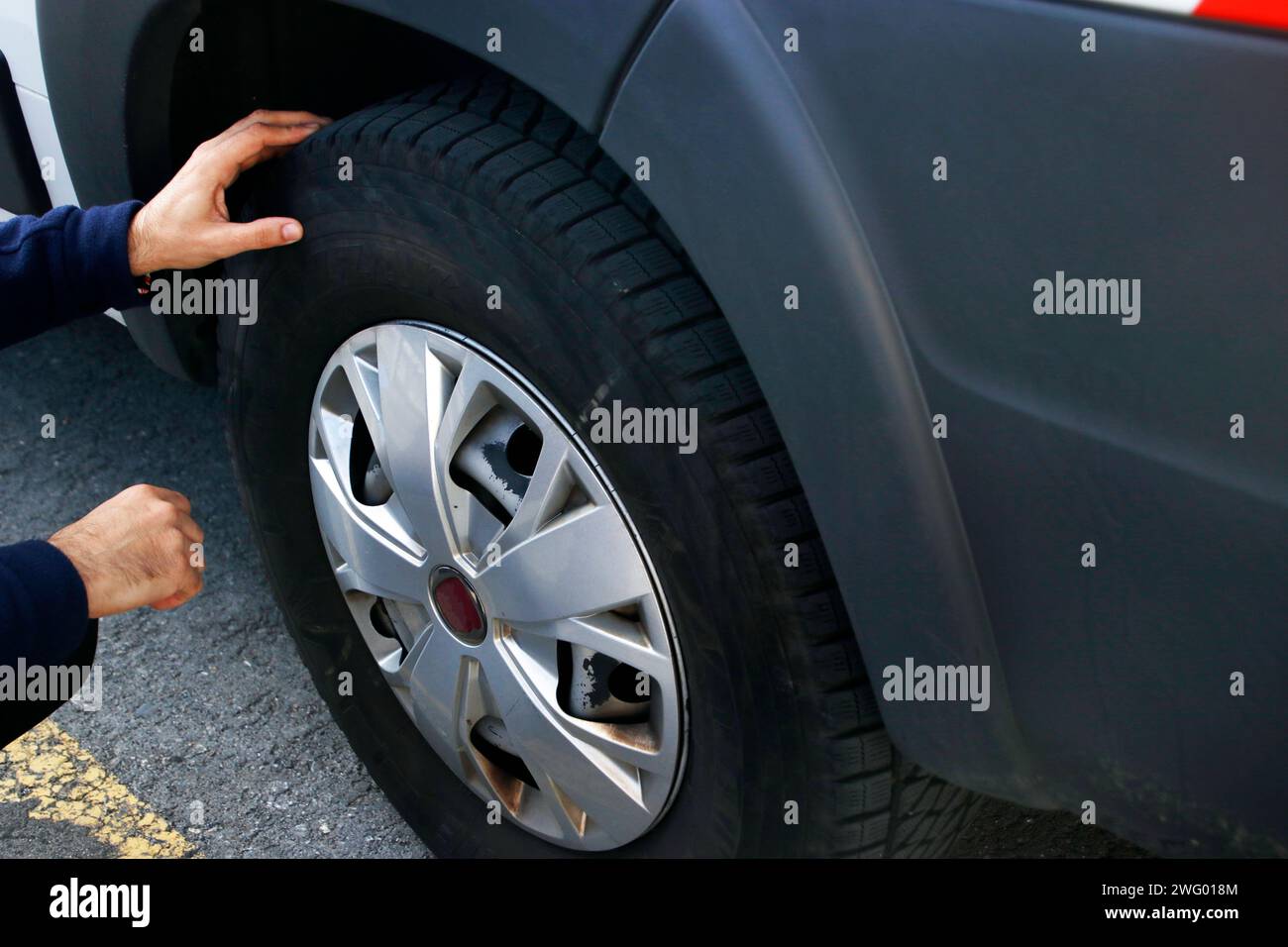 Spare tire installation hi-res stock photography and images - Alamy