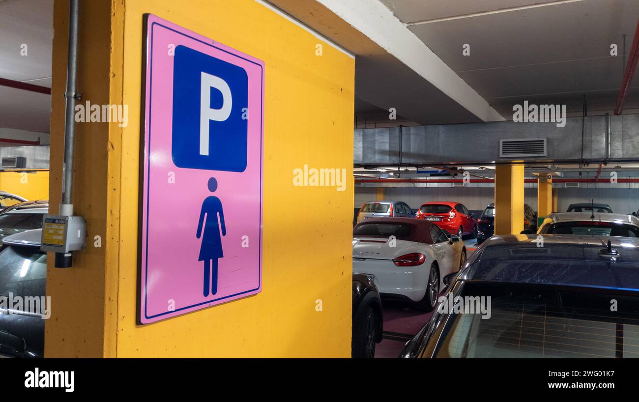Milan , Italy - 01 25 2024 : Lady parking sign text on pink panel background for women in the ...