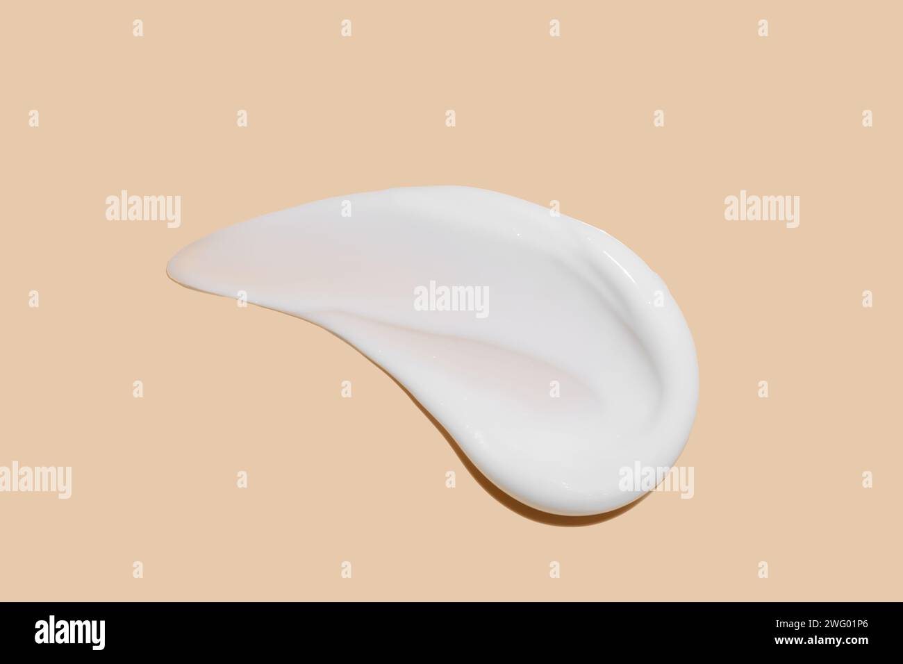 Cosmetic product smear white moisturizing lotion isolated on beige ...