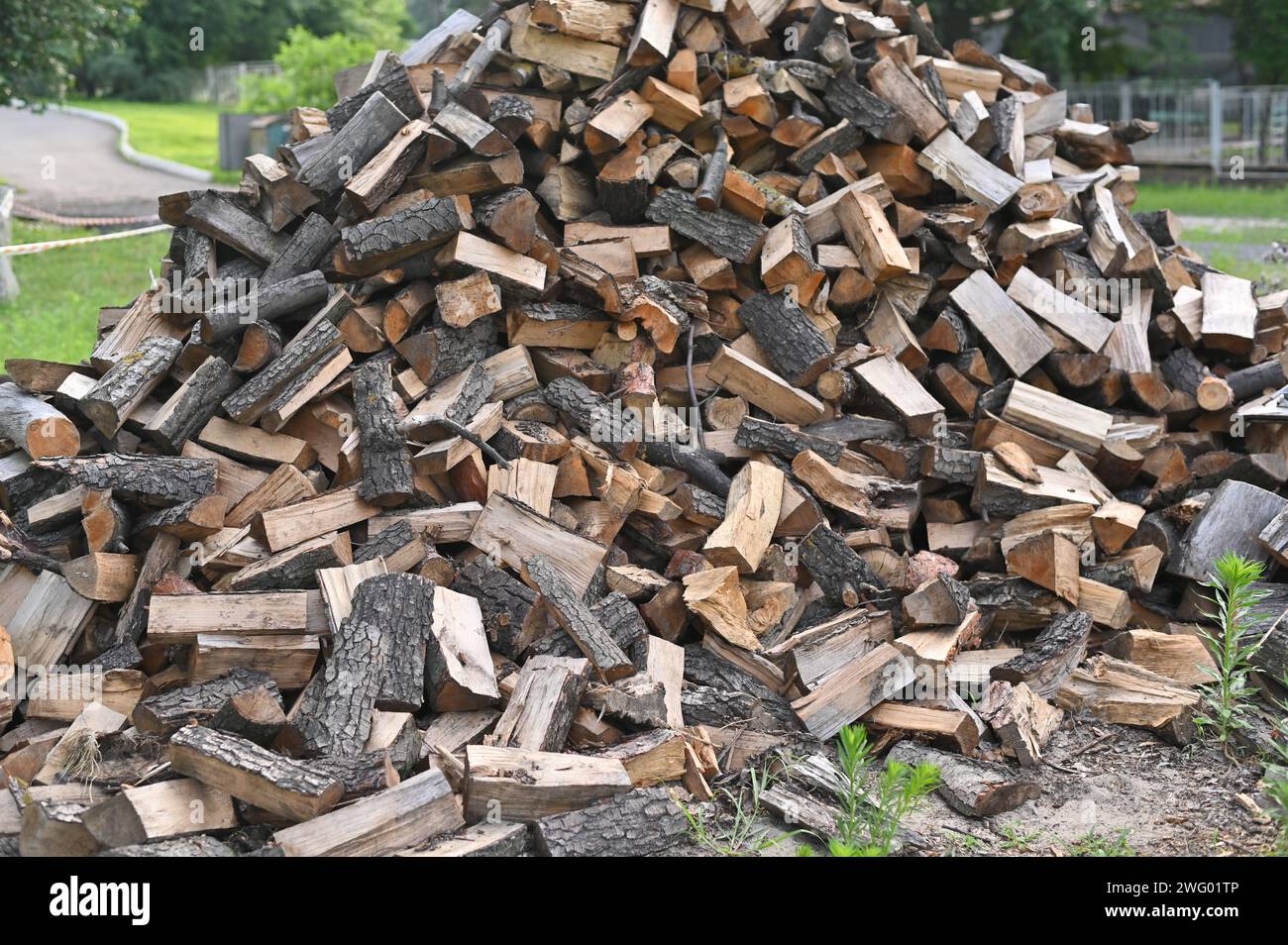 Wooden logs are split into firewood. concept Stock Photo - Alamy