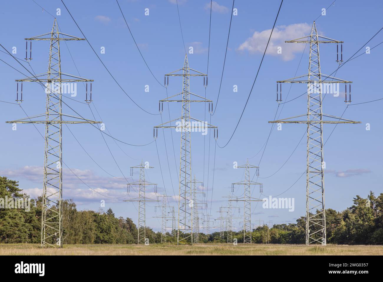 Image of an electricity pylon from the ground perspective in front of a ...