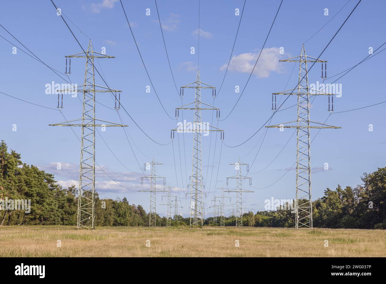 Image of an electricity pylon from the ground perspective in front of a ...