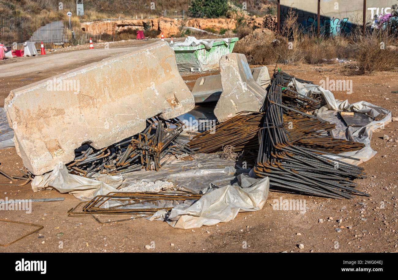 A pile of construction materials outside building site Stock Photo - Alamy