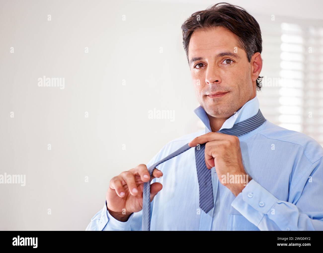 Portrait, tying tie and businessman dressing in home, job or ...