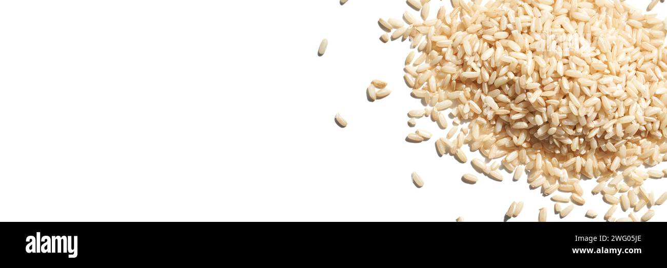 A top view of raw brown and white rice, forming a heap. The integral ...