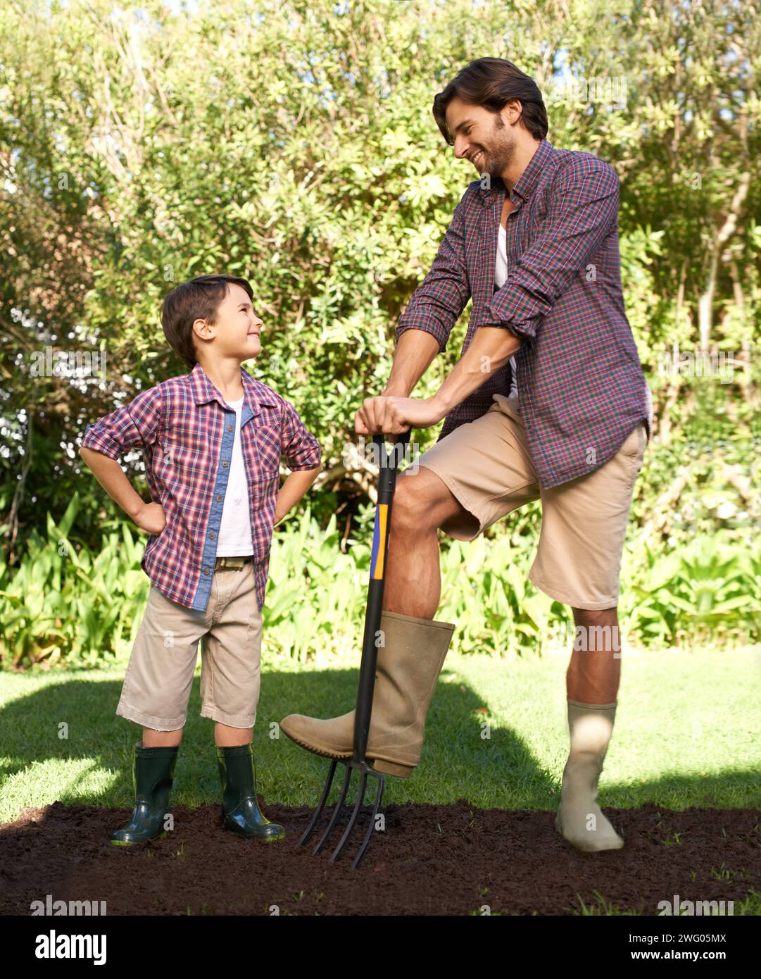 Child, father and smile with gardening in nature using tools for ...