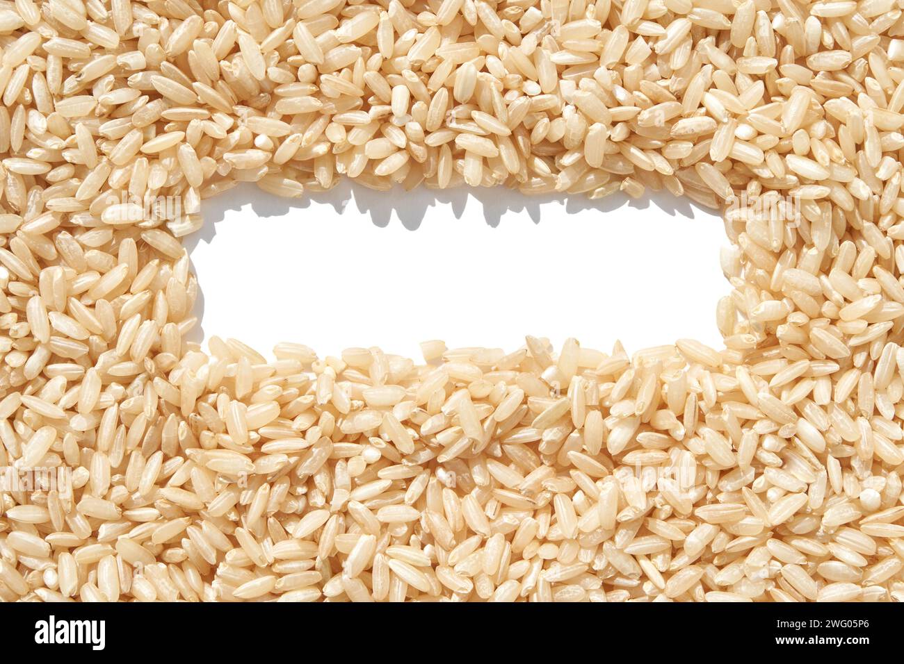 A rectangle frame captures a heap of brown basmati rice on a white ...