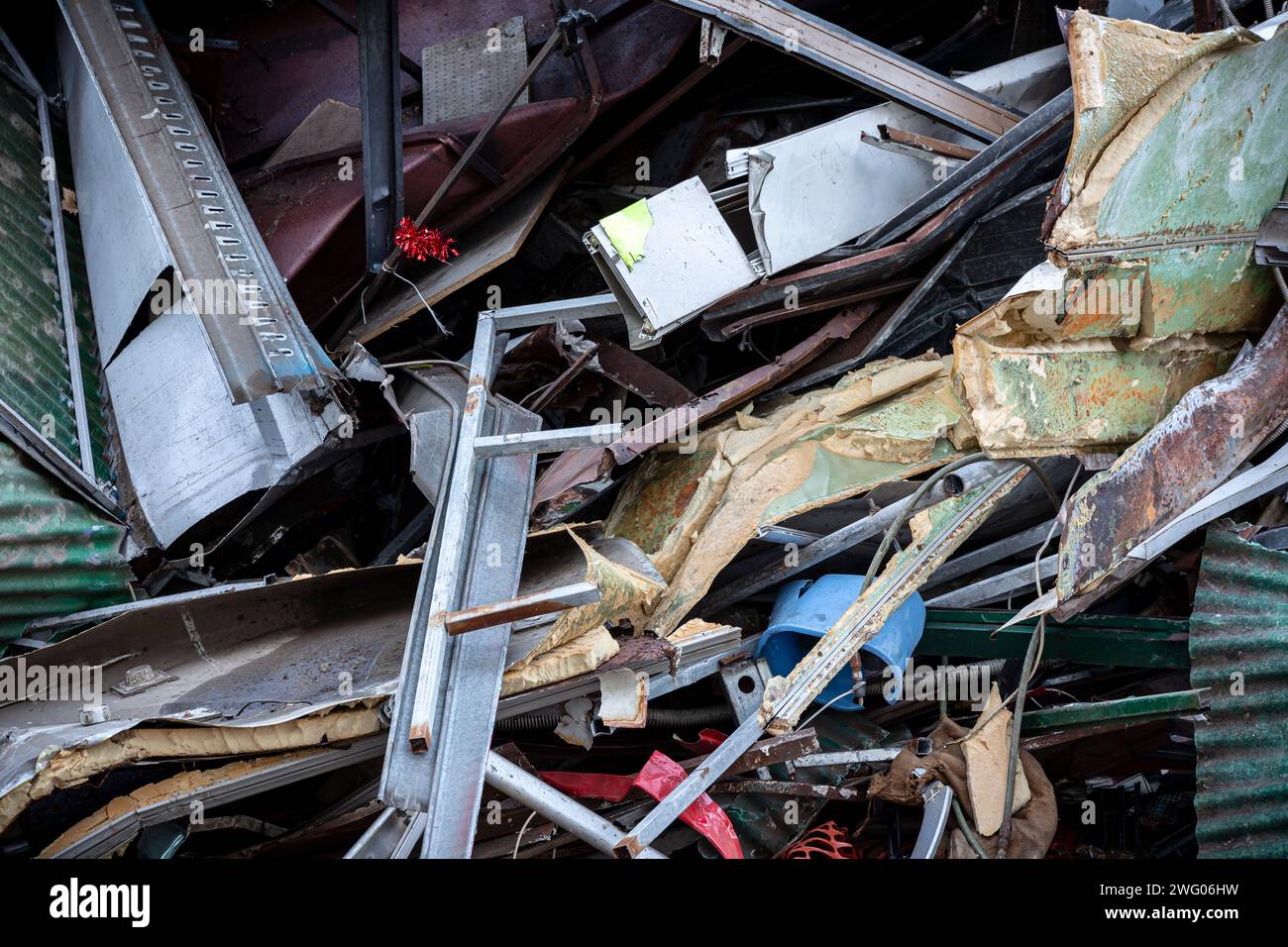 Outdoors closeup shot of a cluttered construction debris pile ...