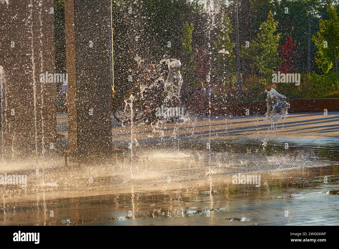 Cool water fountains flow in the summer heat Stock Photo - Alamy